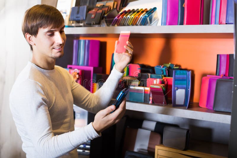 Male Customer Purchasing Wallet . Stock Image - Image of happy, sale ...