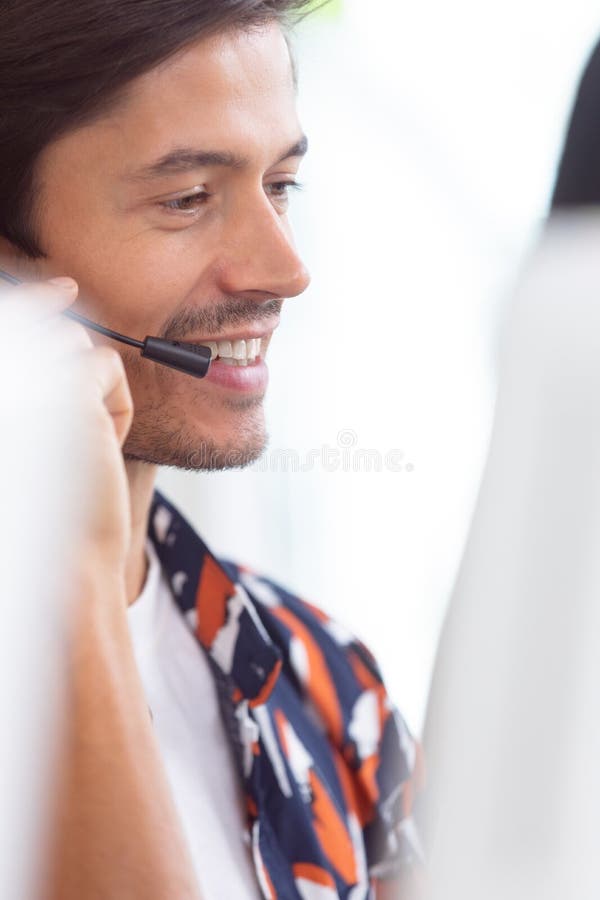 Male Customer Service Executive Working on Computer at Desk Stock Image ...