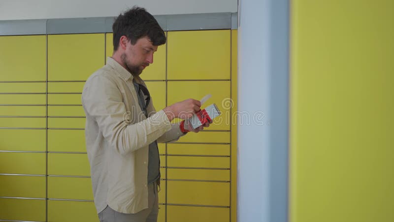 Male Customer Using Self-service Automated Delivery Terminal To Send ...