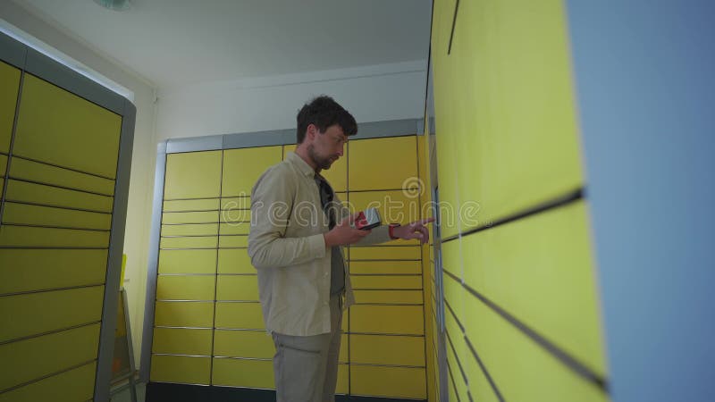 Male Customer Using Self-service Automated Delivery Terminal To Send ...