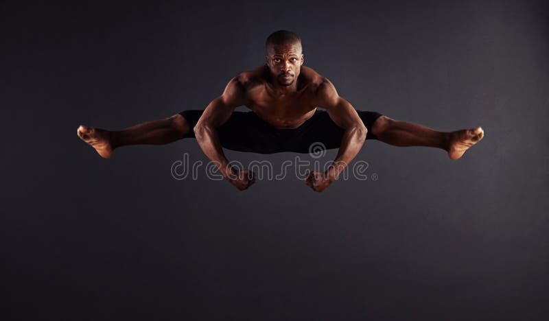 Perfection Attained. Male Dancer Performing the Splits in Mid-air ...