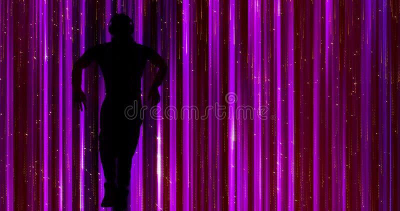 Male Dancer Suspended In Mid Air Against A Dark Background With Light