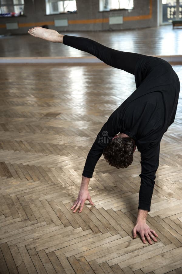 Male Dancer Stretching at Gym Stock Photo - Image of healthy, athletic ...