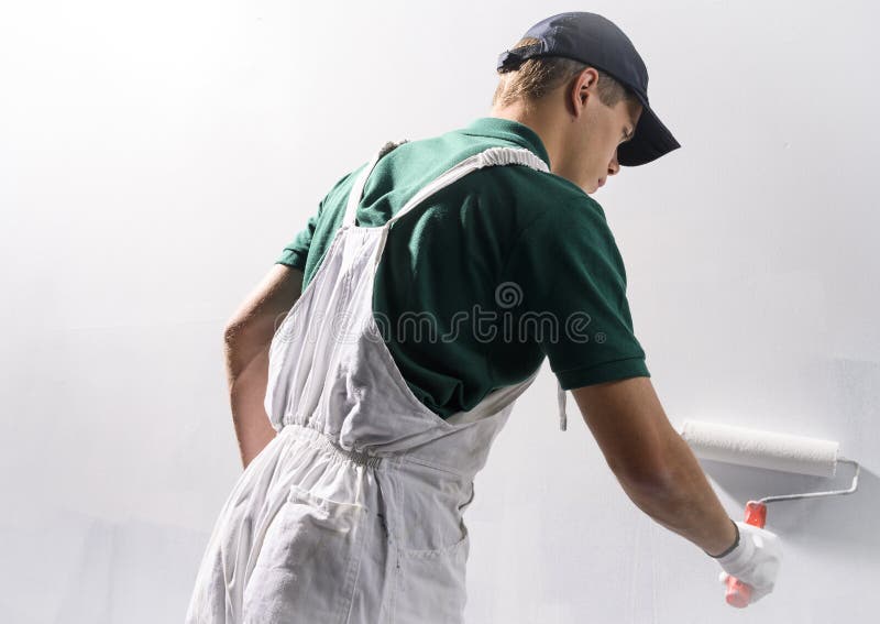 Man Painting a Wall in White Color Stock Image - Image of rear, young ...