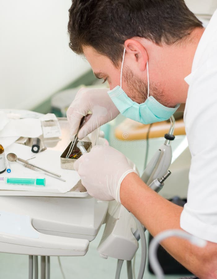 Male dentist working stock image. Image of hospital, chair - 9683211