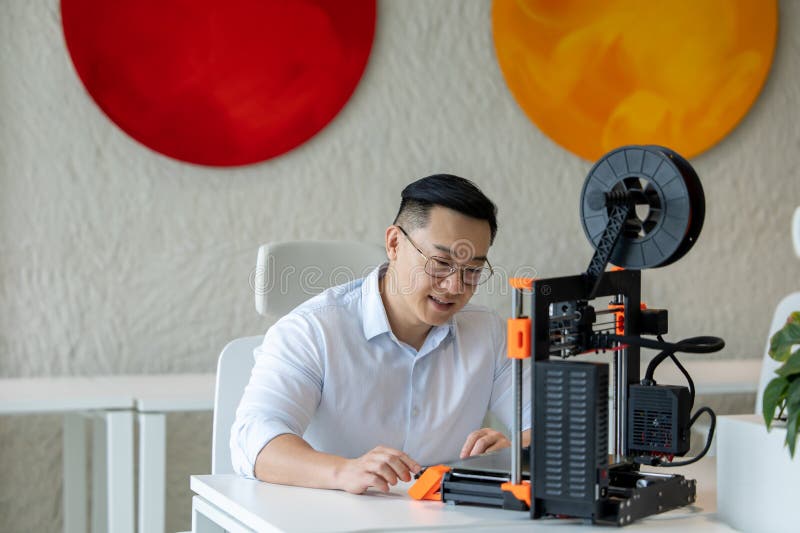 Male Designer Using 3D Printer in Office, Working with New Technology ...