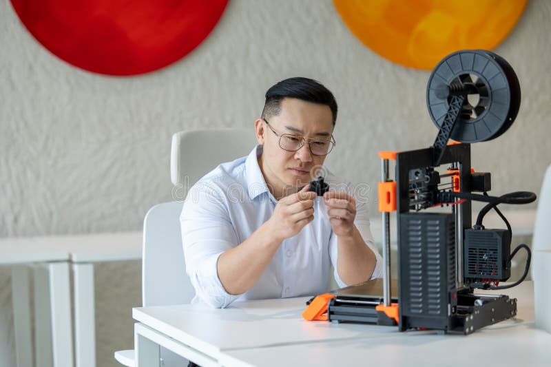 Male Designer Using 3D Printer in Office, Working with New Technology ...