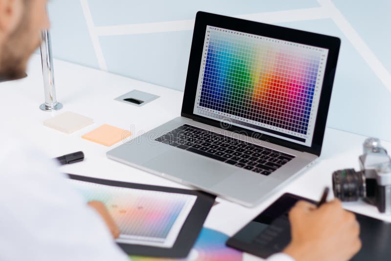 Male Designer Using a Graphics Tablet and a Laptop . Stock Photo ...