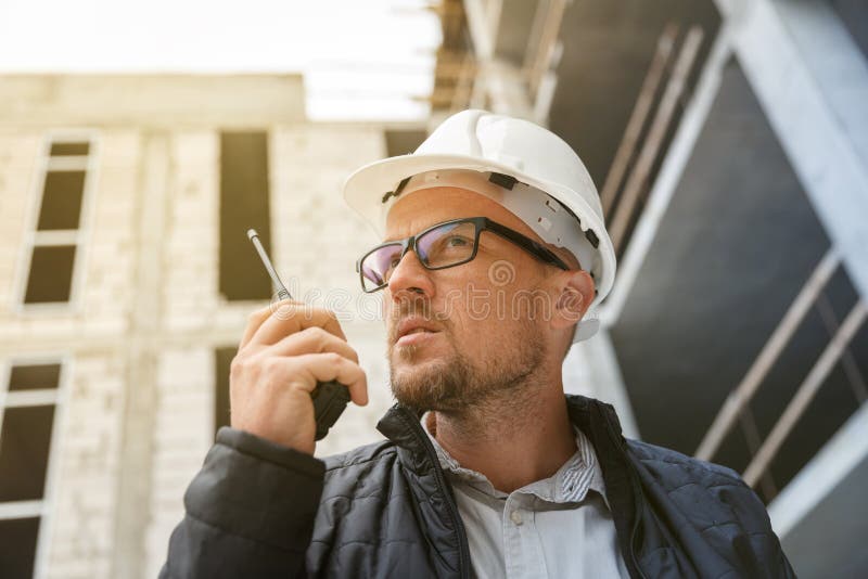 Male Head Engineer Wearing White Safety Hardhat with Walkie Talk Stock ...