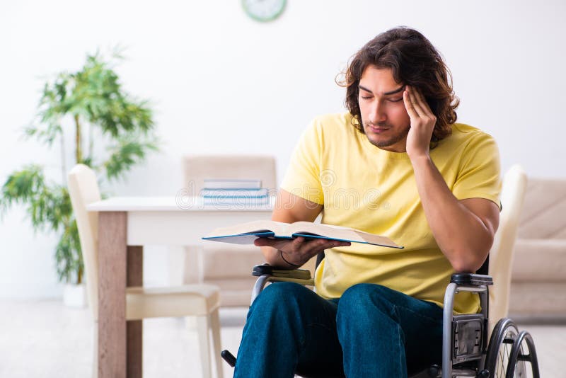 Male Disabled Student Preparing for Exams at Home Stock Photo - Image ...