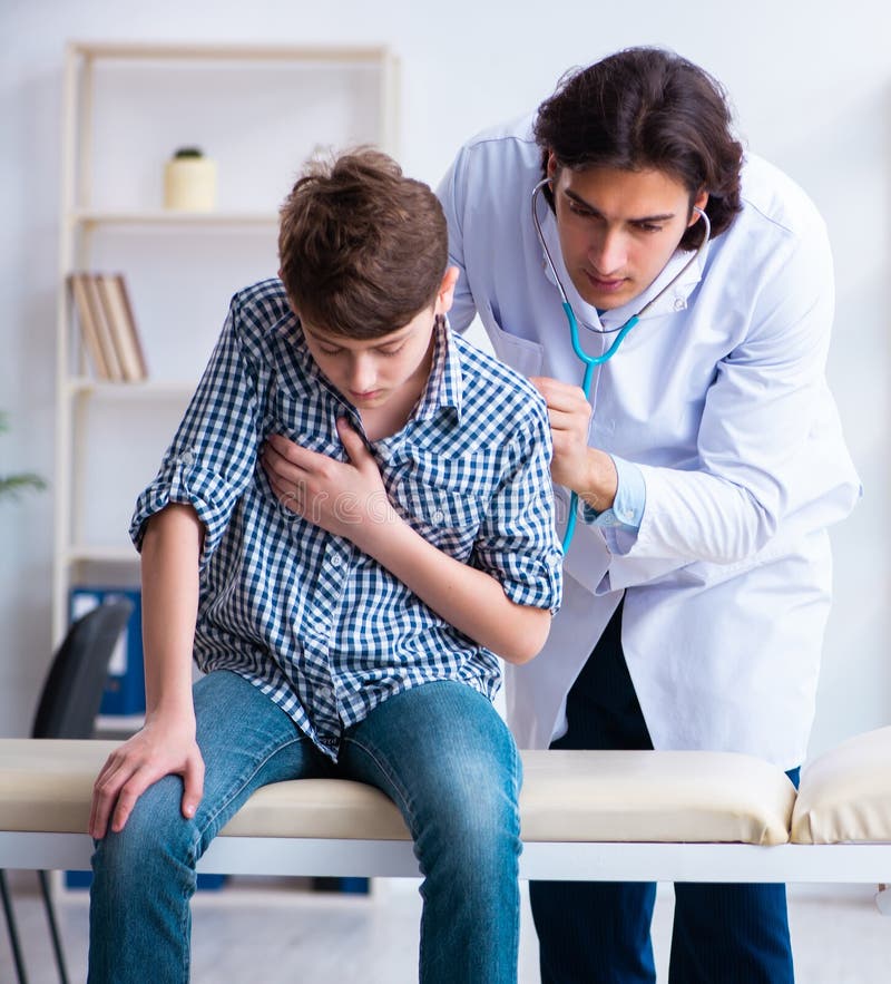 Male Doctor Examining Boy by Stethoscope Stock Photo - Image of medical ...