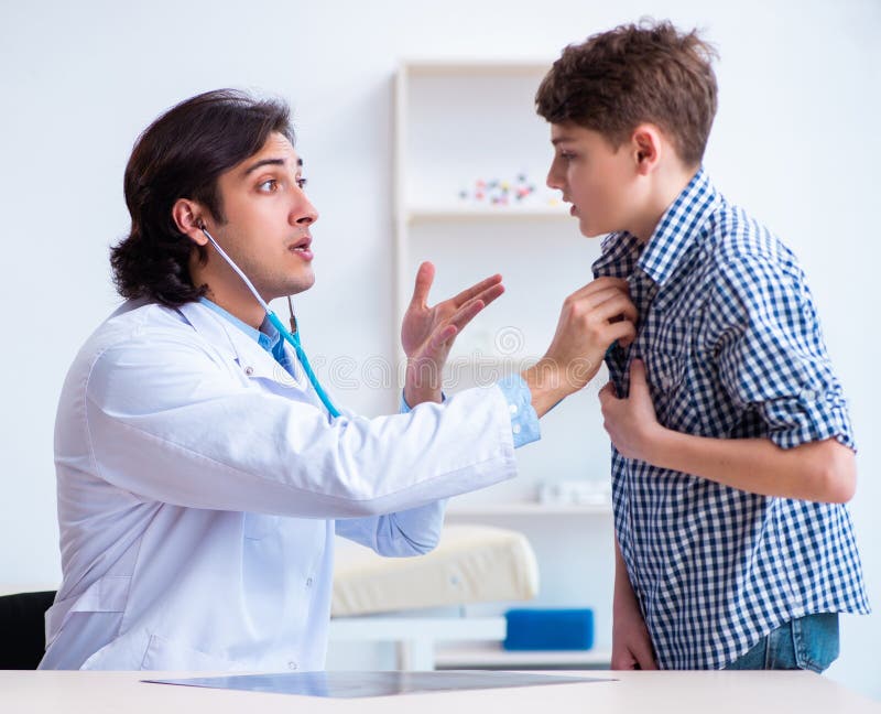 Male Doctor Examining Boy by Stethoscope Stock Image - Image of ...