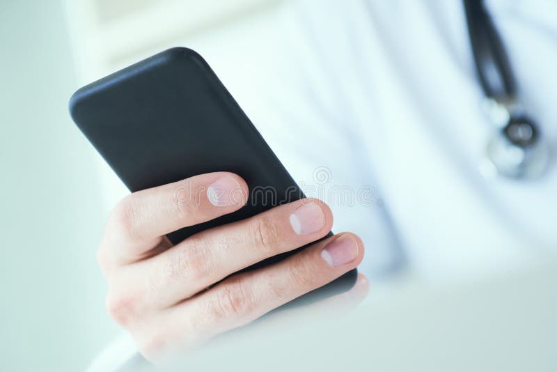 Male Doctor Hands with Mobile Phone Close-up. Male Doctor in White Coat ...
