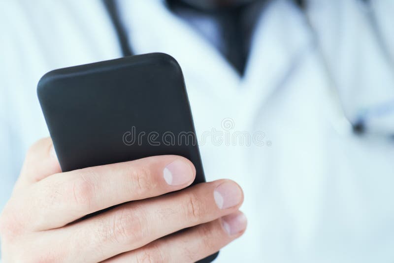 Male Doctor Hands with Mobile Phone Close-up. Male Doctor in White Coat ...