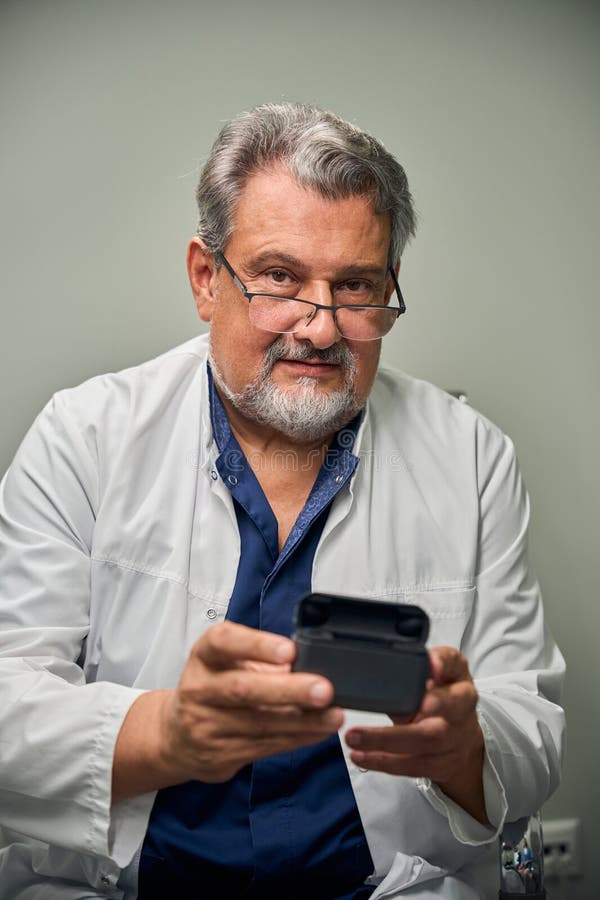 Male Doctor in Lab Coat Using Smartphone Stock Image - Image of health ...