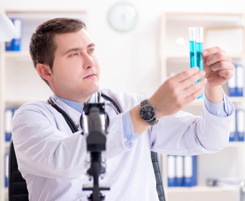 Male Doctor Looking at Lab Results in Hospital Stock Image - Image of ...
