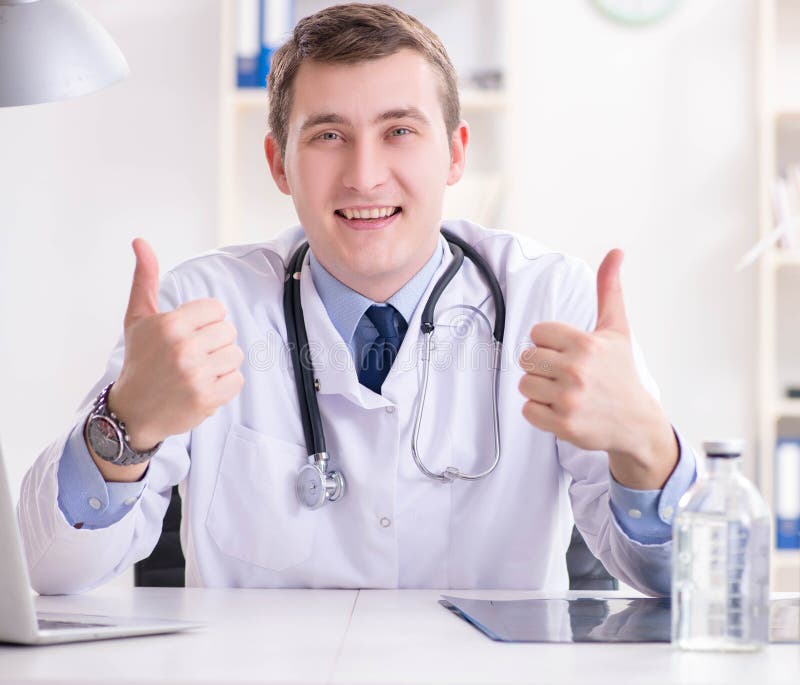 Male Doctor Looking at Lab Results in Hospital Stock Photo - Image of ...
