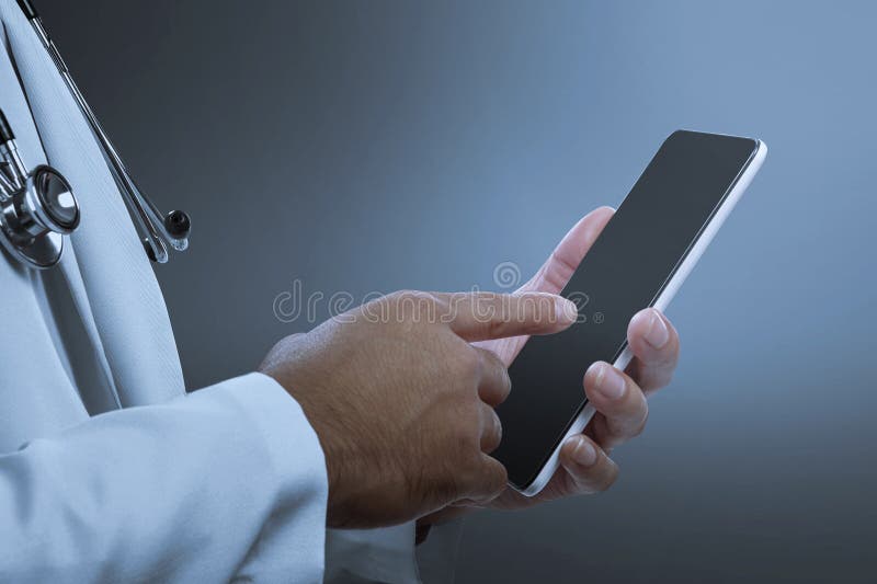 Male Doctor with a Stethoscope Using a Mobile Phone Stock Image - Image ...