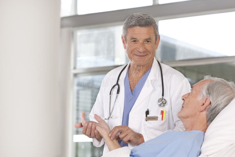 Male Doctor Taking Care of Patient Stock Image - Image of portrait ...