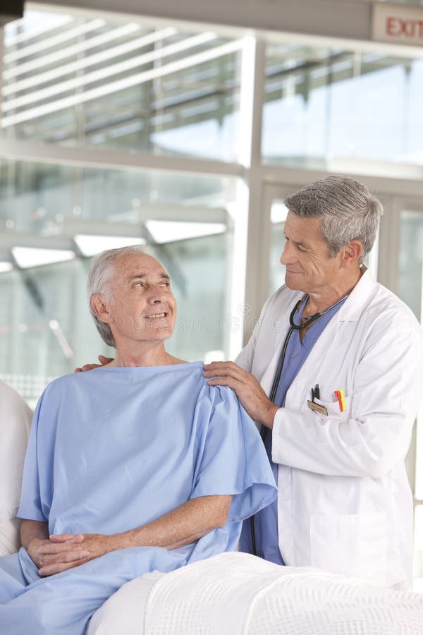 Male Doctor Taking Care of Patient Stock Image - Image of patient ...