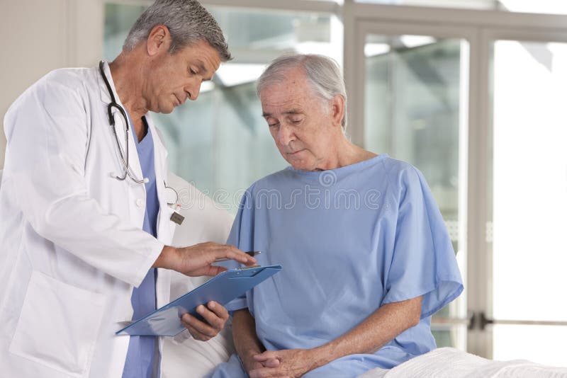 Male Doctor Taking Care of Patient Stock Photo - Image of hospital ...