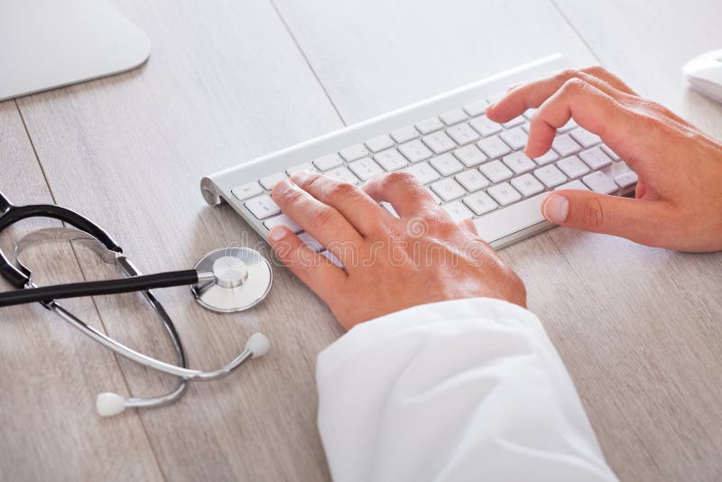 Male Doctor Typing on Computer Keyboard Stock Photo - Image of pressing ...