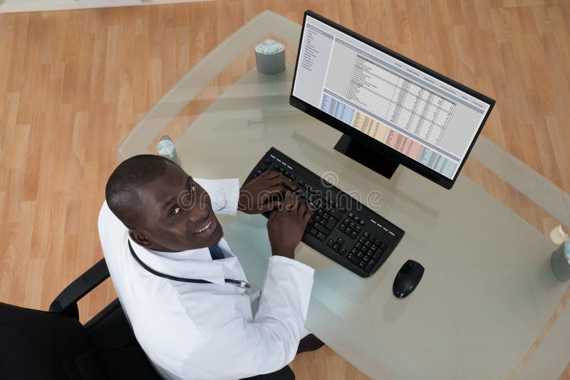 Male Doctor Typing on Computer Keyboard Stock Image - Image of health ...