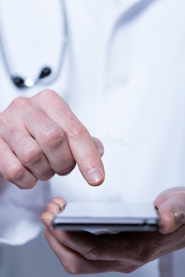 Male Doctor Using Mobile Phone Stock Image - Image of phone ...