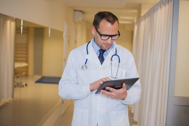 Senior Doctor Using His Tablet Computer Stock Image - Image of hospital ...