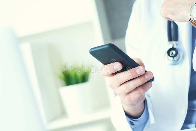 Doctor Holding Phone With Male Doctor On The Screen. Stock Image ...