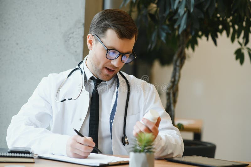 Male Doctor Working in Clinic Stock Image - Image of occupation ...