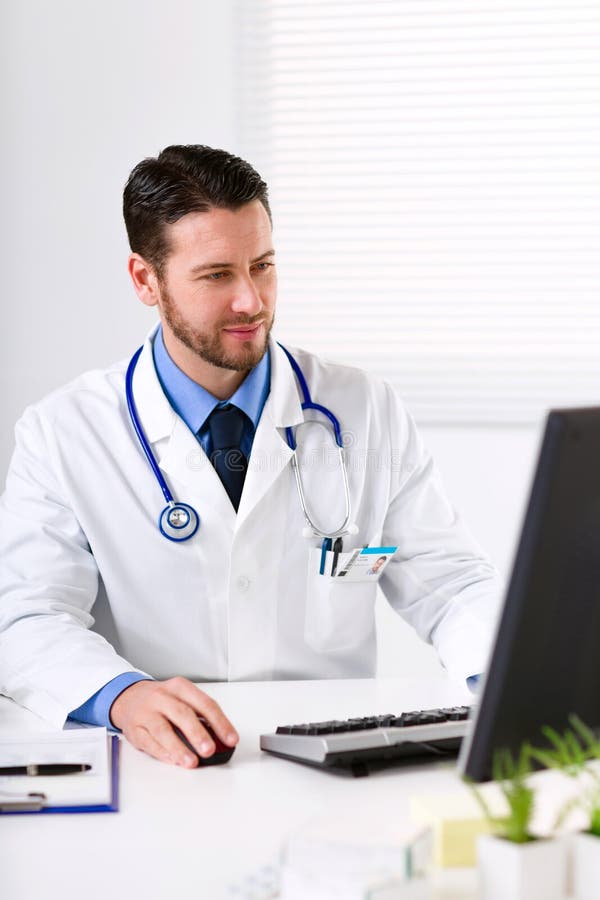Male Doctor Working at Computer Stock Image - Image of clinic, handsome ...