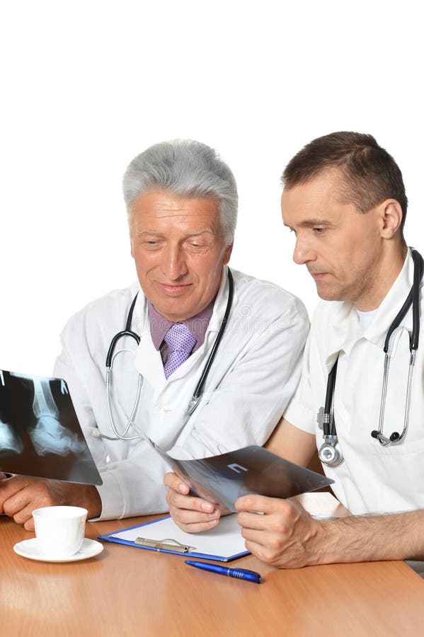 Male doctors with x-rays stock photo. Image of doctors - 83740242