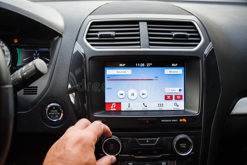The Male Driver is Adjusting the Volume of the Car Audio System Stock ...