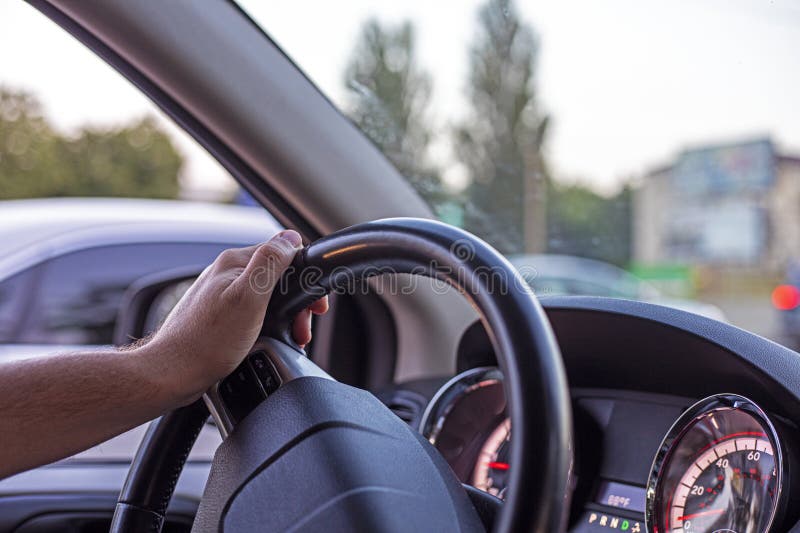 Male Driver is Driving in a Passenger Car during a Traffic Jam ...