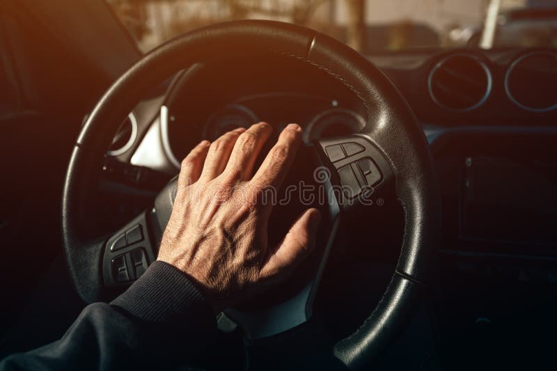 Male Driver Placing a Hand on Car Steering Wheel Horn Stock Image ...