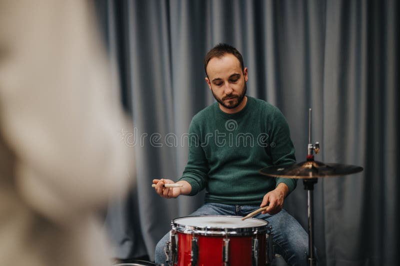 Male Drummer Playing in a Music Studio with Focused Expression Stock ...
