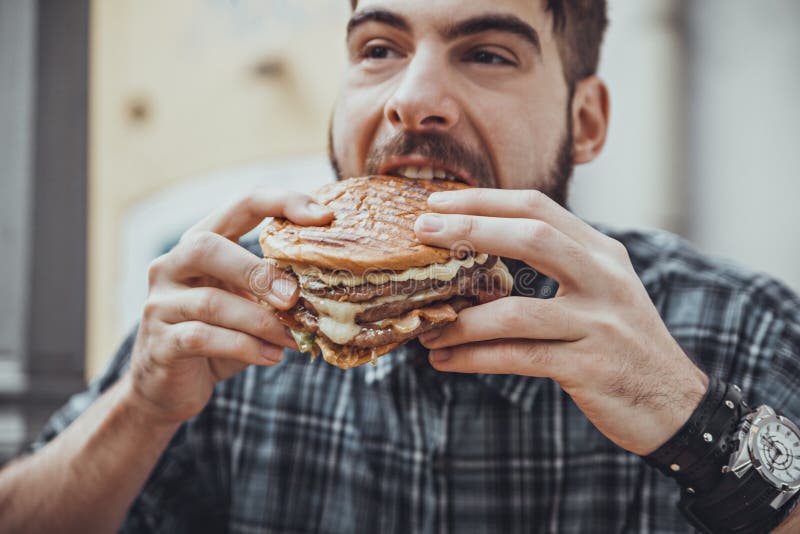 Male Eating Burger stock photo. Image of activity, caucasian - 78990532