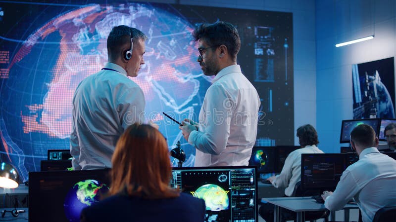 Male Ecologists Discussing Data on Tablet in Office Stock Photo - Image ...