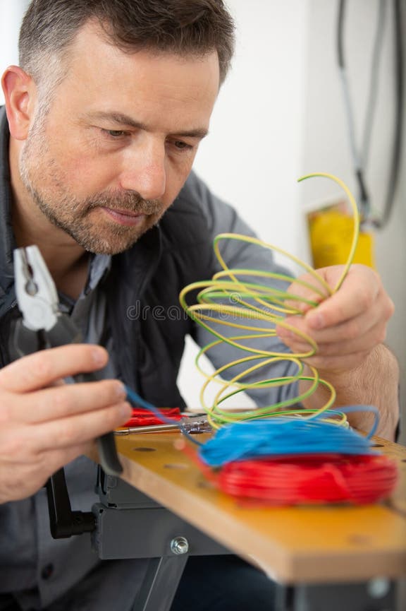 Male Electrician Builder Working with Cables Stock Photo - Image of ...