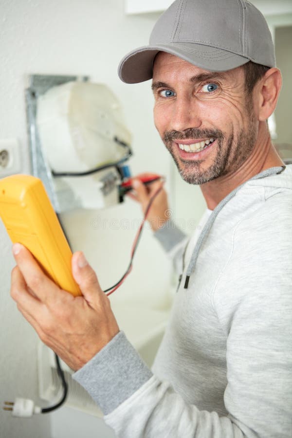 Male Electrician Checking Device with Digital Multimeter Stock Image ...