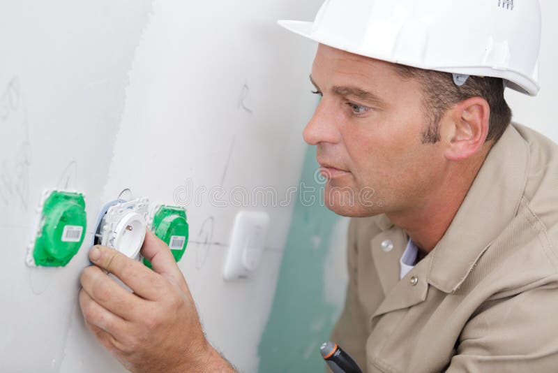 Male Electrician Fitting Plug Socket Stock Image - Image of room ...