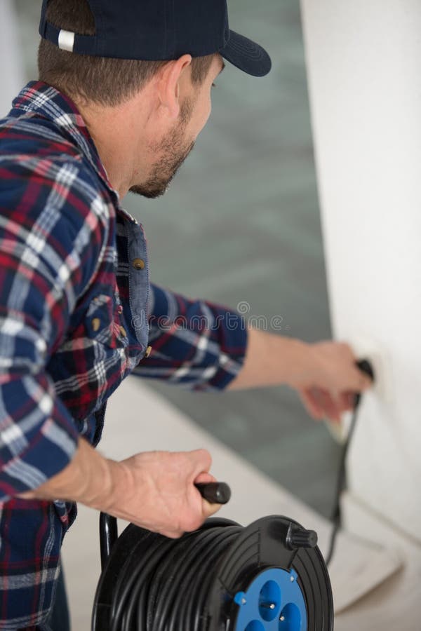 Male Electrician Holding Electric Plug Stock Image - Image of ...