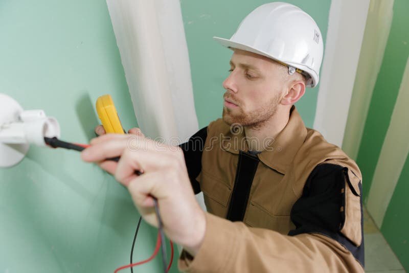 Male Electrician Installing Security System Stock Photo - Image of ...