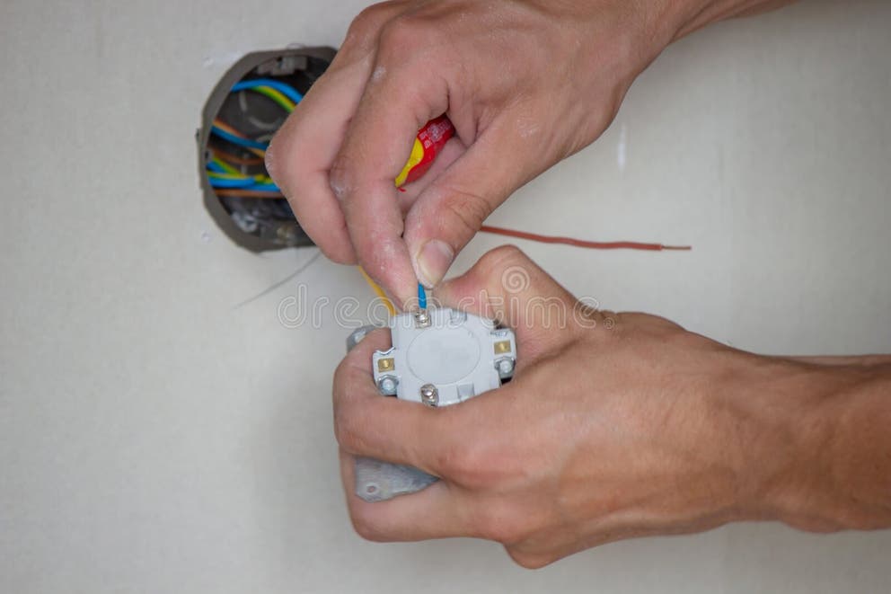 Male Electrician Installing Socket. Selective Focus Stock Image - Image ...