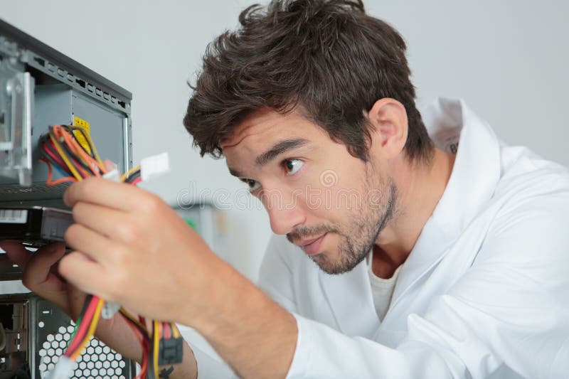 Male Electronic Equipment Assembler Stock Photo - Image of focused ...