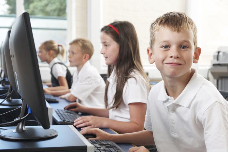 Male Elementary Pupil In Computer Class Stock Photo - Image of person ...