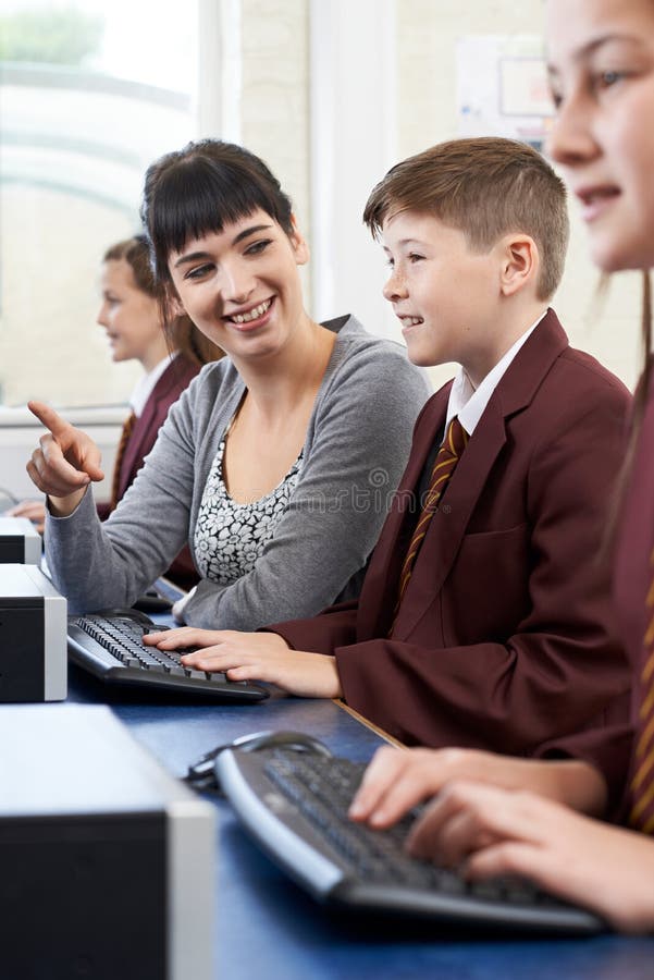 Pupils Wearing School Uniform in Computer Class Stock Photo - Image of ...