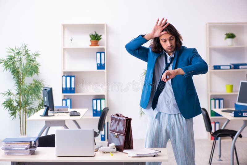 Male Employee Coming To Work Straight from Bed Stock Photo - Image of ...