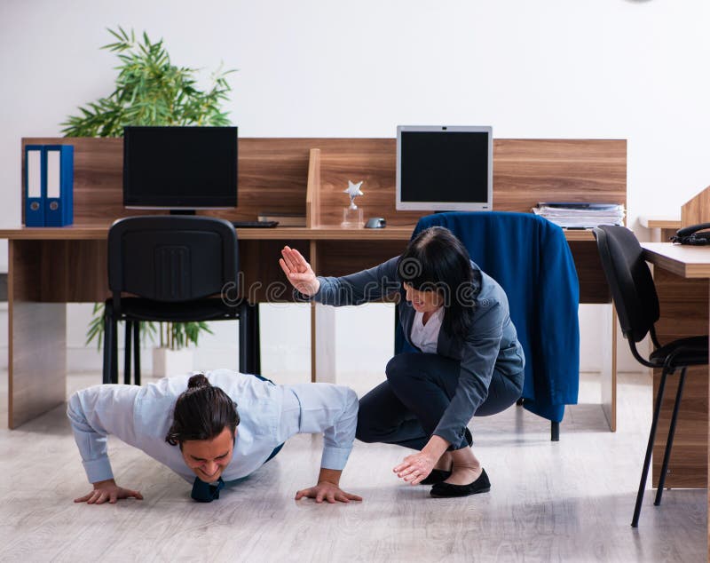 Male Employee Doing Sport Exercises in the Office Stock Image - Image ...